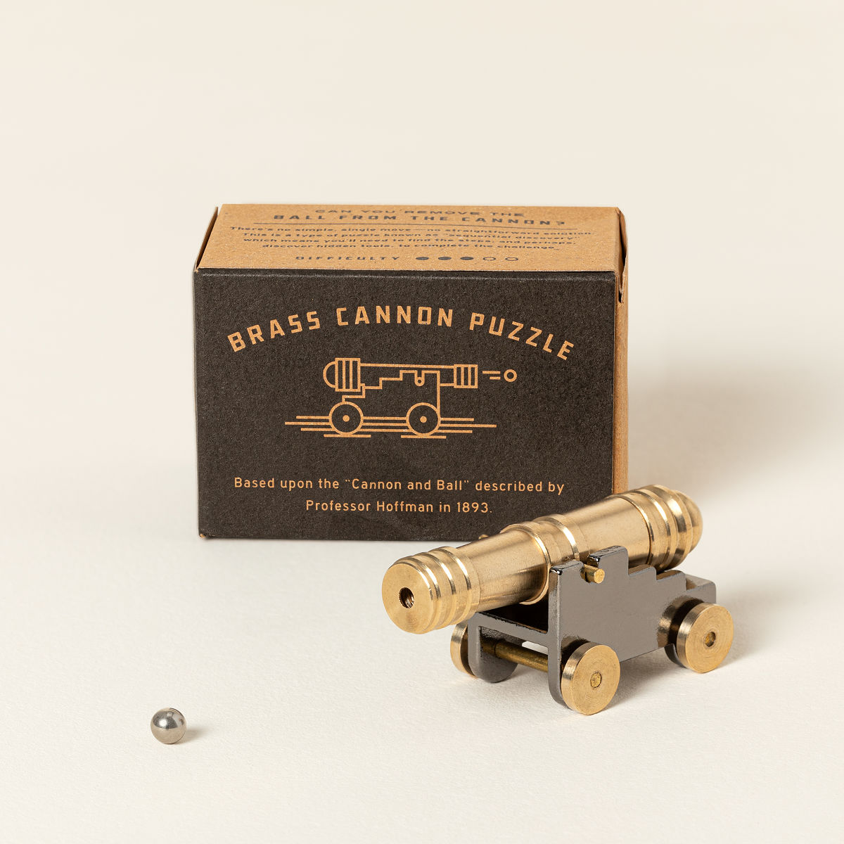 Uncommon Goods | Brass Cannon Sequential Puzzle | sequential puzzle